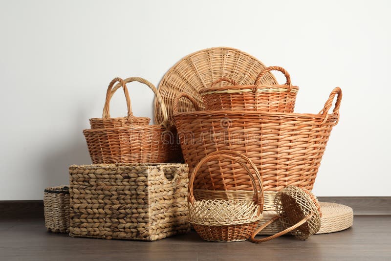 Many Different Wicker Baskets Made of Natural Material on Floor Near ...