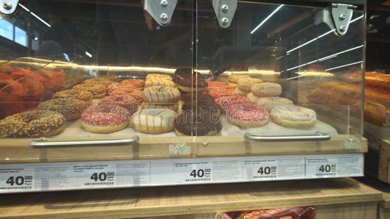 Many Donuts on Shelves in a Supermarket or Bakery. Stock Footage ...