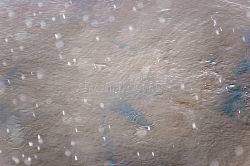 Many Drops of Hail and Rain Break on the Water Surface of the River ...