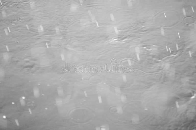 Many Drops of Hail and Rain with Fast Speed Break on the Water Surface ...