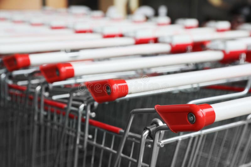 Many Empty Metal Shopping Carts, Closeup View Stock Photo - Image of ...