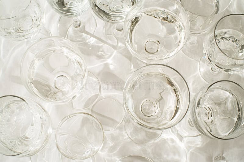Many Empty Wine Glasses Creating Caustic Patterns on White Background ...