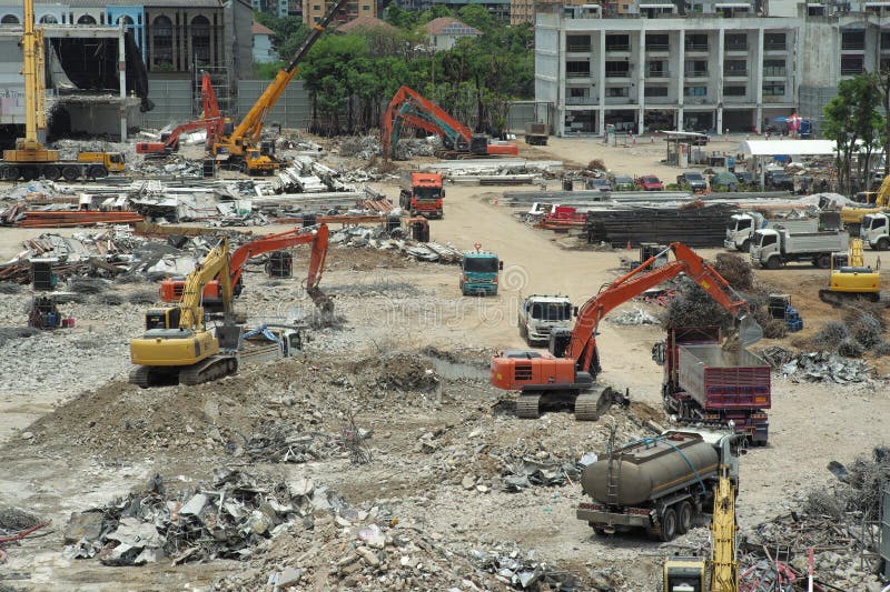 Many Excavators Working on the Ground of the Construction Site while ...