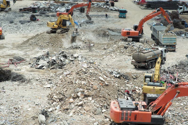 Many Excavators Working on the Ground of the Construction Site while ...