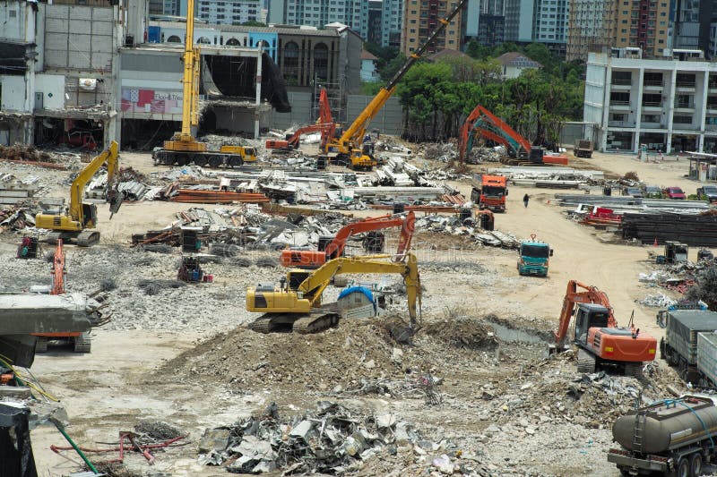 Many Excavators Working on the Ground of the Construction Site while ...