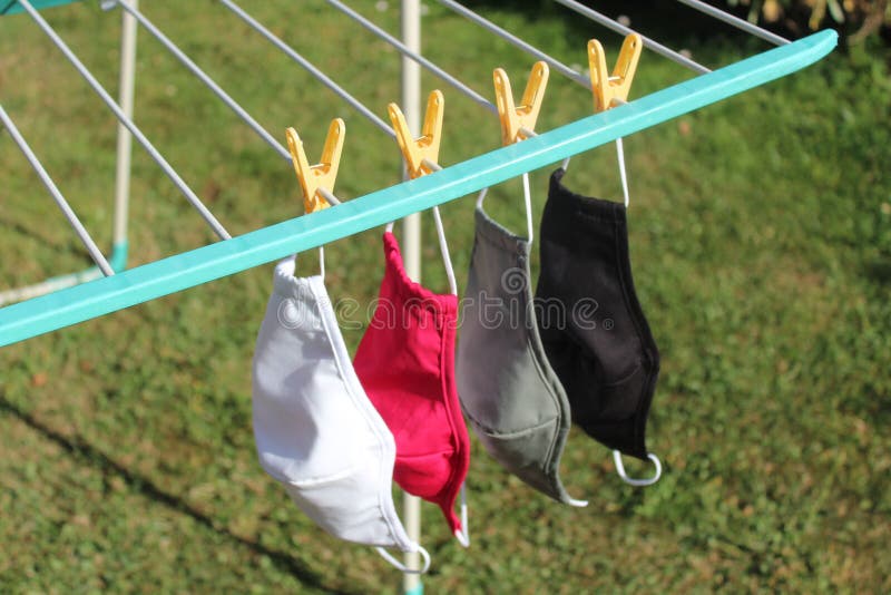 Many Face Masks on a Clothesline Stock Image - Image of clothesline ...