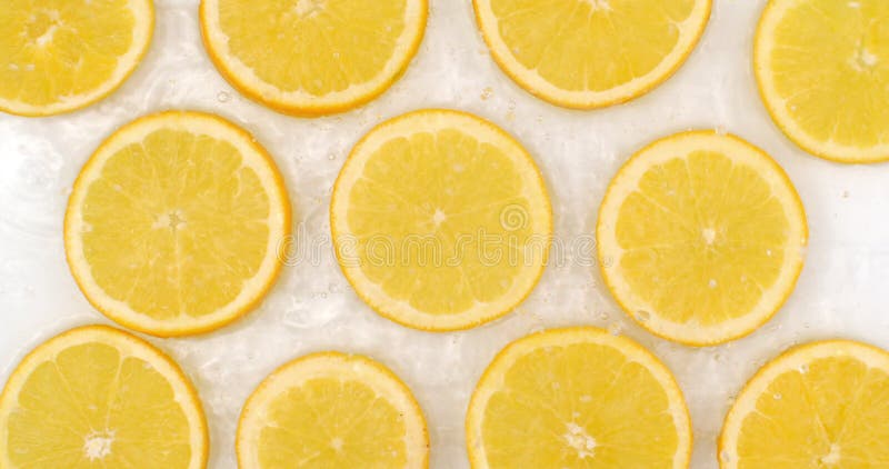 Many Fresh Lemon, Top View of Water Flowing on a White Background Stock ...