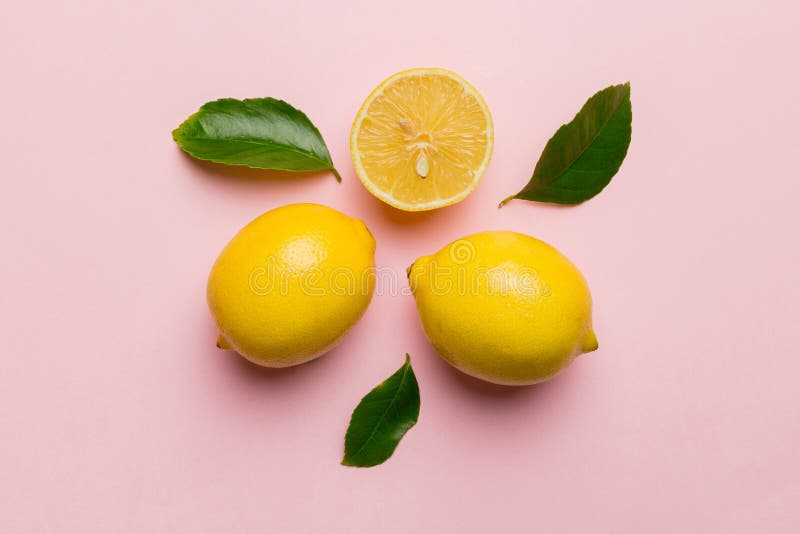 Many Fresh Ripe Lemons with Green Leaves on Colored Background, Top ...