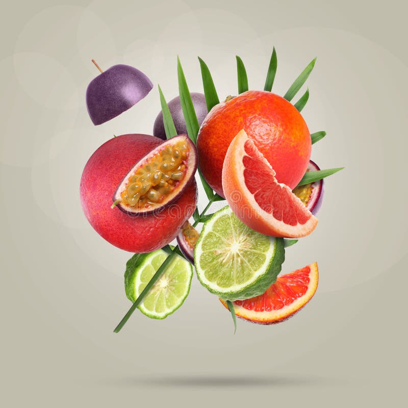 Many Fresh Tropical Fruits Falling on Light Background Stock ...