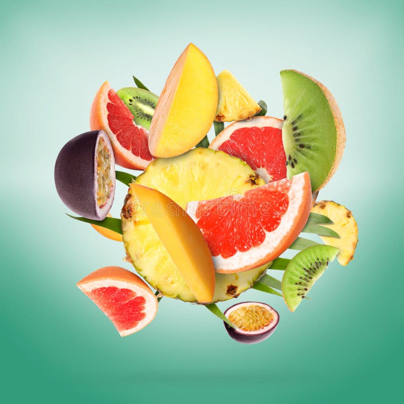 Many Fresh Tropical Fruits Falling on Turquoise Background Stock Photo ...
