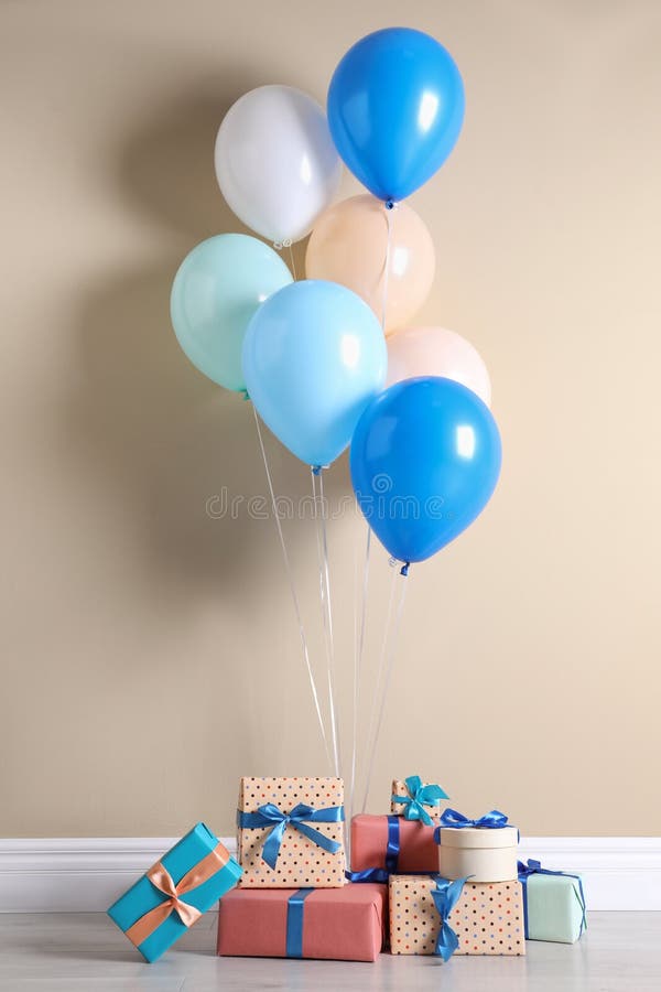 Many Gift Boxes and Balloons Near Beige Wall Stock Image - Image of ...
