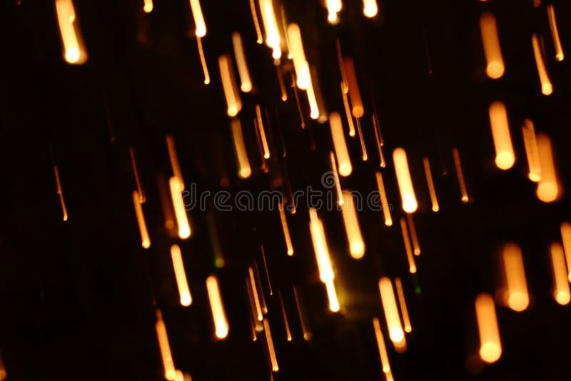 Many Gold Color Light Moving Vertical on Black Background Stock Photo ...