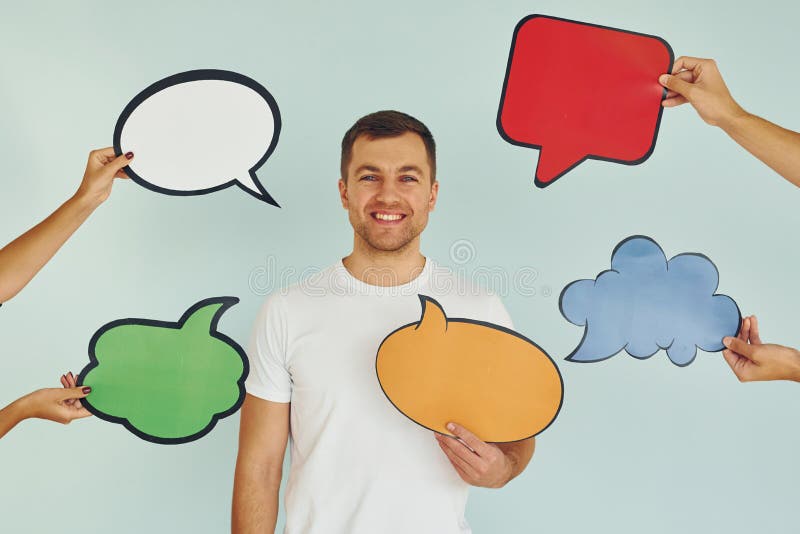 Many Hands Holding Signs. Man Standing in the Studio Stock Image ...