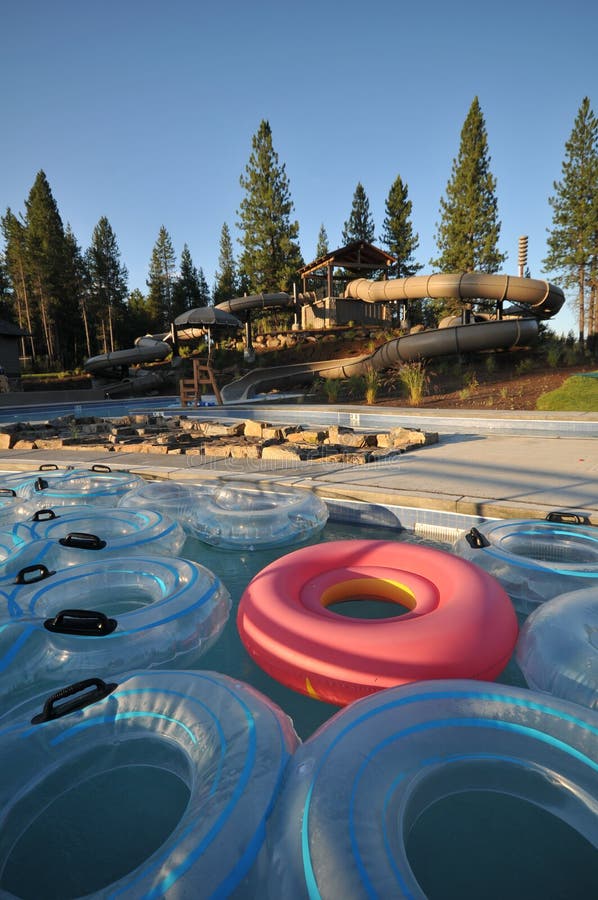 Many Inner Tubes Floating in Pool at Water Park Stock Image - Image of ...