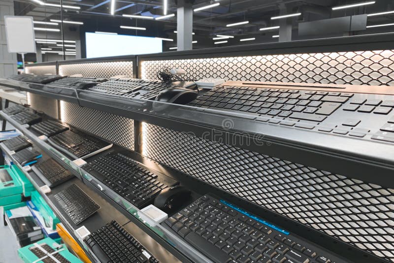 Many Keyboards in the Electronics Store. Shelves with Keyboards in the ...