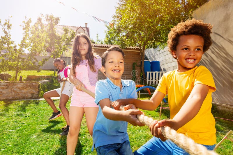 Group of Kids Play Pulling Rope Game on Playground Stock Photo - Image ...