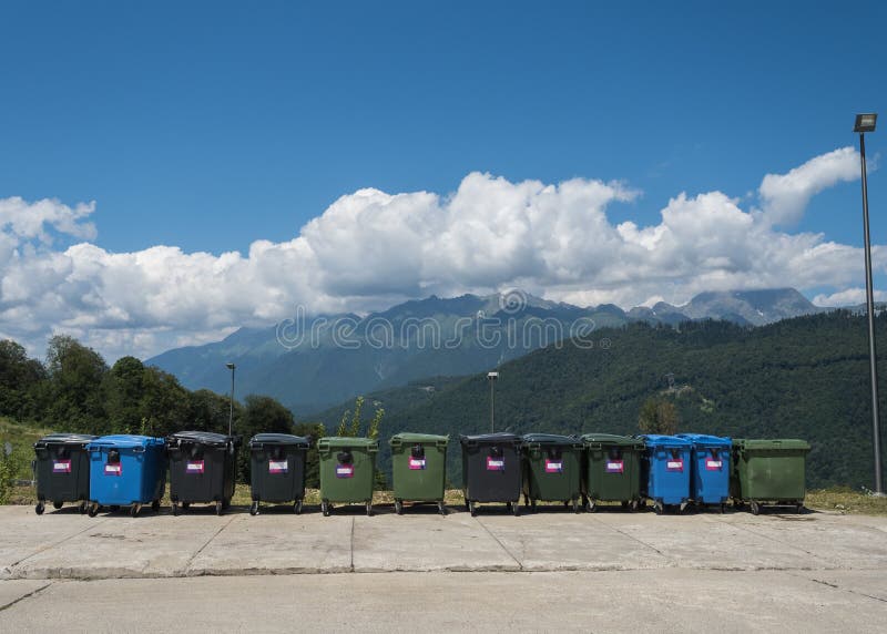 Many Large Garbage Cans Stand in a Row Against the Backdrop Beautiful ...