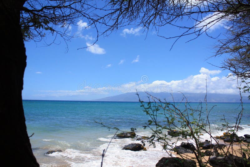 Many Lava and Tree Frame Mountains Inside a Ocean in Hawaii Stock Photo ...