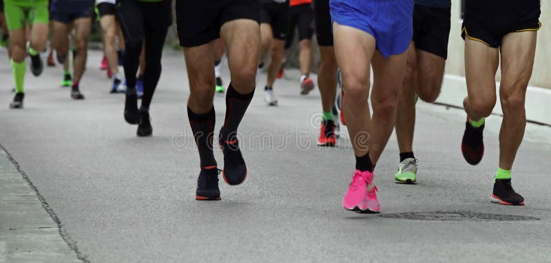 RUNNERS run on the road stock image. Image of exhausting - 51529489