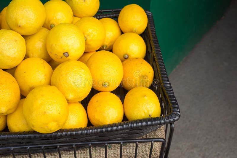 Many Lemons in a basket stock image. Image of yellow - 77150277