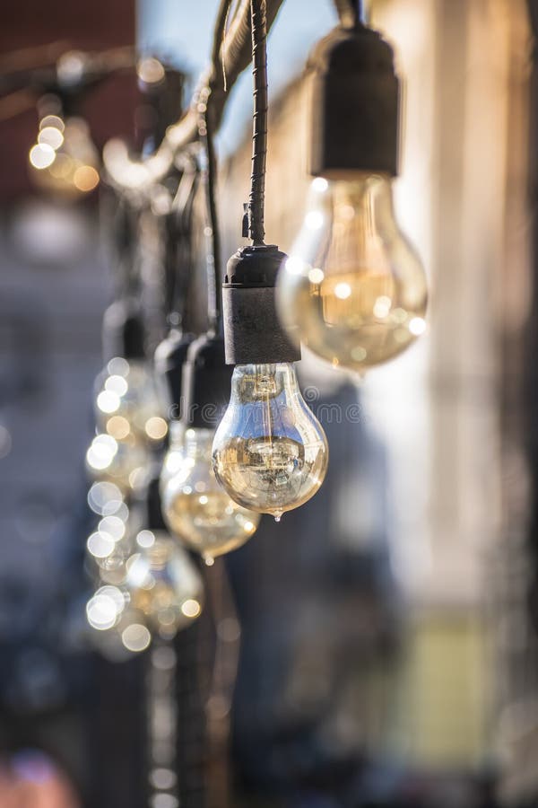 Many Light Bulbs on the Wire. Lighting in the Cafe Stock Photo - Image ...