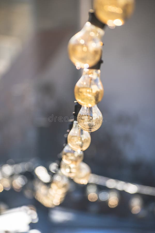 Many Light Bulbs on the Wire. Lighting in the Cafe Stock Photo - Image ...