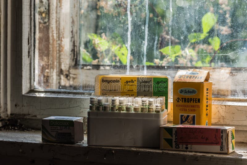 Many Little Glass Container and Medication on a Window Sill Editorial ...