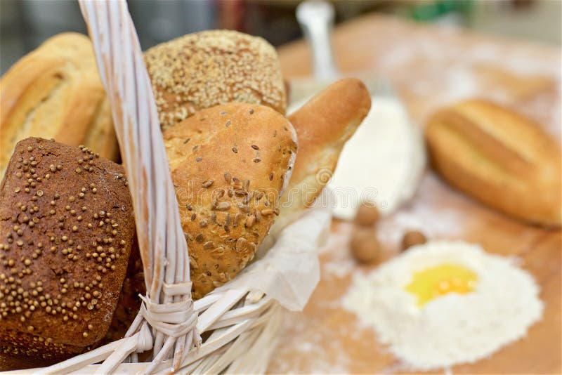 Many Mixed Breads in Wicker Basket on the Table Stock Image - Image of ...
