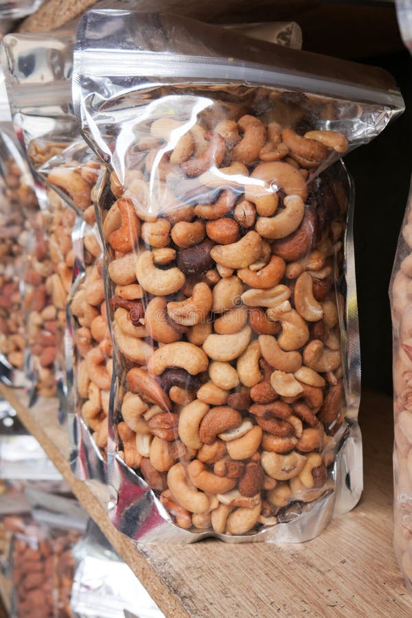 Many Mixed Nuts in a Plastic Packet on Shelf Stock Photo - Image of ...