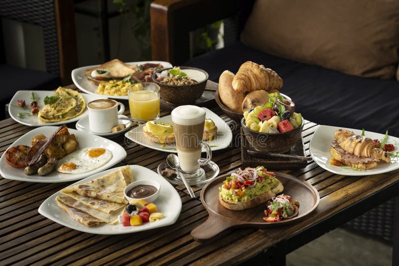 Many Mixed Western Breakfast Food Items on Cafe Table Stock Photo ...