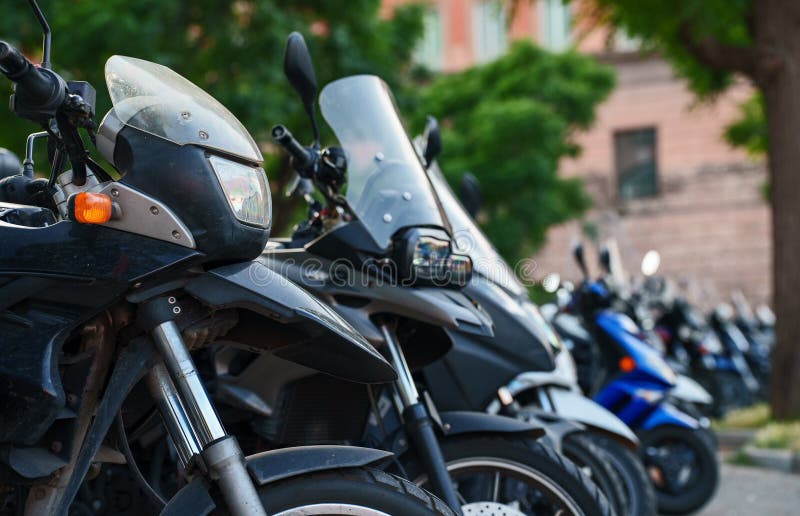 Many motorcycles parked stock photo. Image of club, rental - 258117216