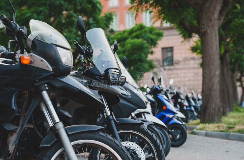 Many motorcycles parked stock photo. Image of rental - 258117220