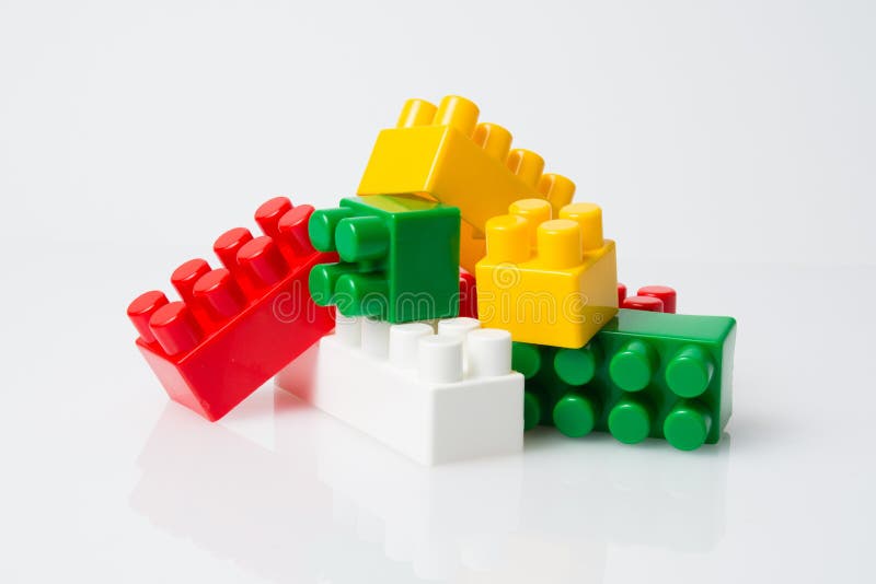 Many Multi-colored Cubes of Blocks of Children`s Constructor on a White ...