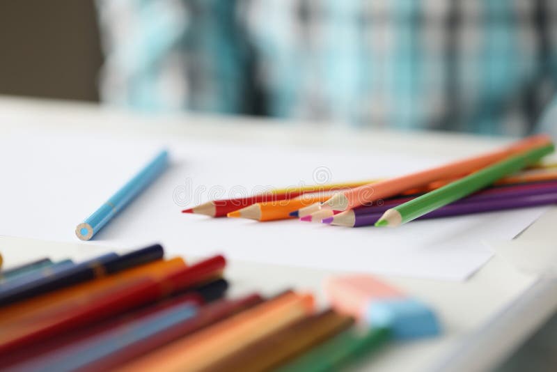 Many Multi-colored Pencils Lying on Blank Sheet of Paper Closeup Stock ...