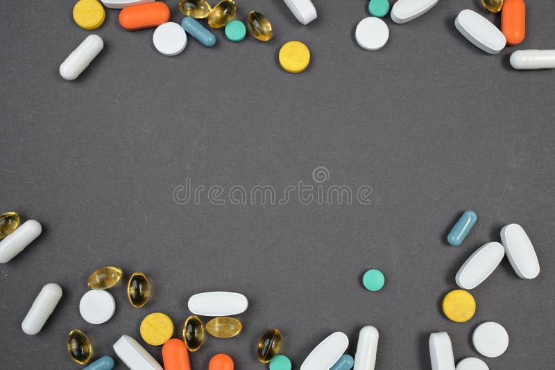 Many Multi-colored Tablets of Different Shapes on Gray Background from ...