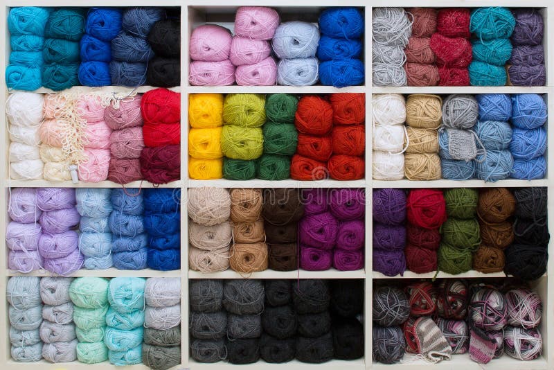 Many Multi-colored Threads for Knitting in Cells. Stock Photo - Image ...