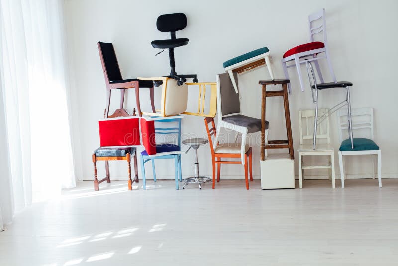 Many Multicolored Chairs Stand in the White Room Stock Image - Image of ...