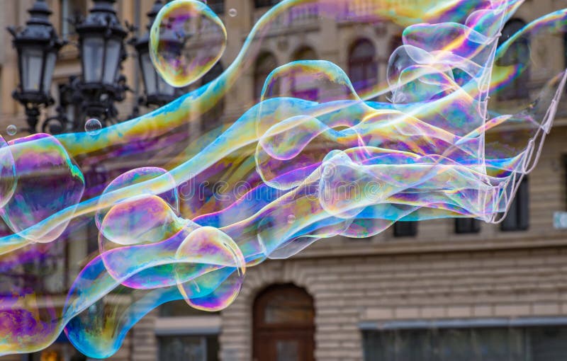 Many Multicolored Giant Soap Bubbles Flying in the Air on a Windy Day ...