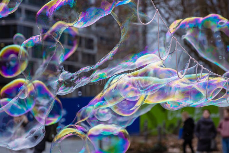 Many Multicolored Giant Soap Bubbles Flying in the Air on a Windy Day ...