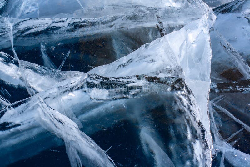 Many Natural Deep Cracks in the Ice of Lake Baikal. Stock Photo - Image ...