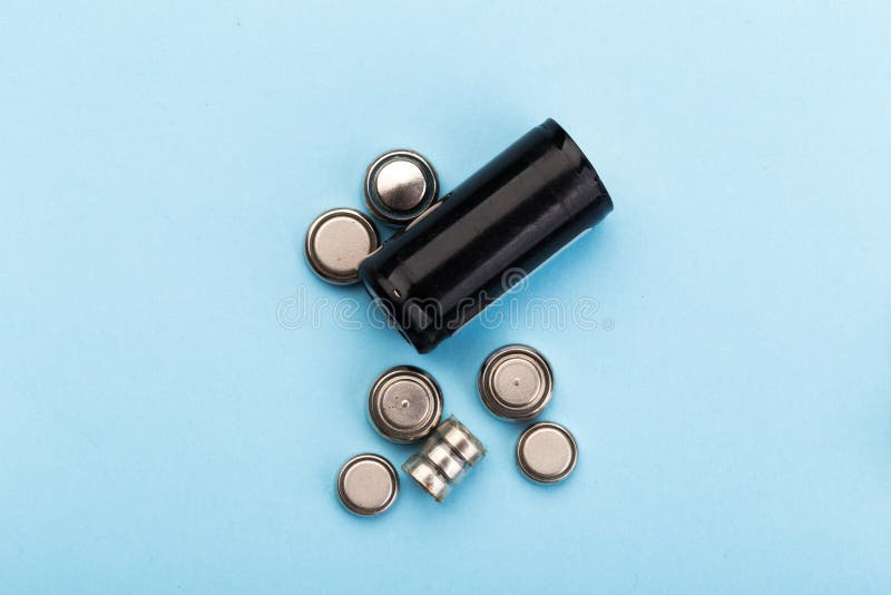 Many New and Used Batteries of Different Shapes, AA, Round Batteries on ...