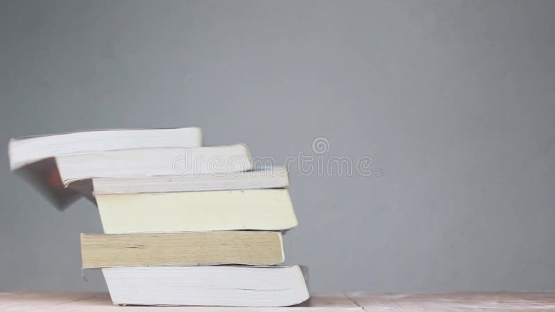 Many Old Books Falling on the Table and Spread Dust Throughout the Room ...