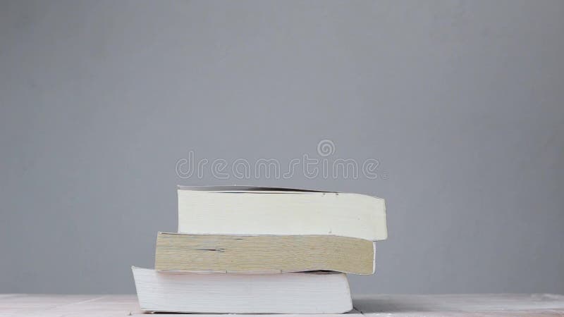 Many Old Books Falling on the Table and Spread Dust Throughout the Room ...