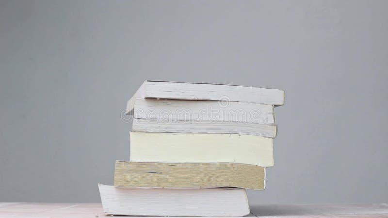 Many Old Books Falling on the Table and Spread Dust Throughout the Room ...