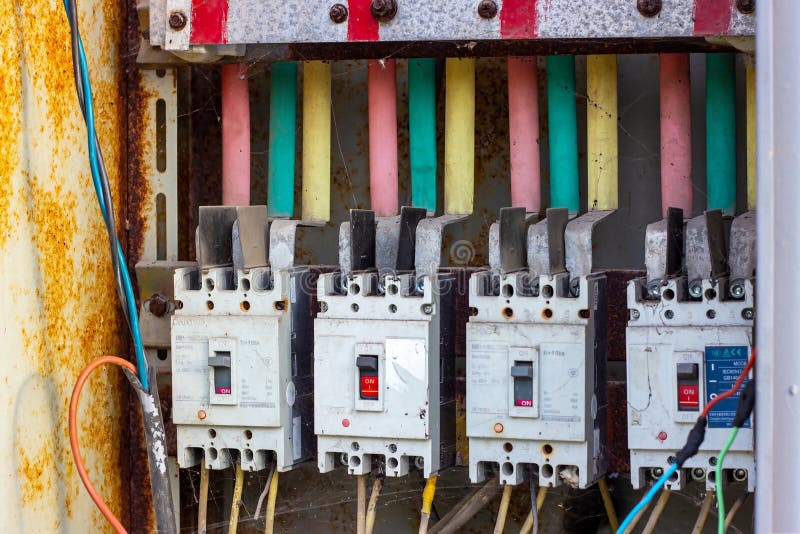 Many Old Rusty Electrical Fuse Boxes with Electic Cables Editorial ...