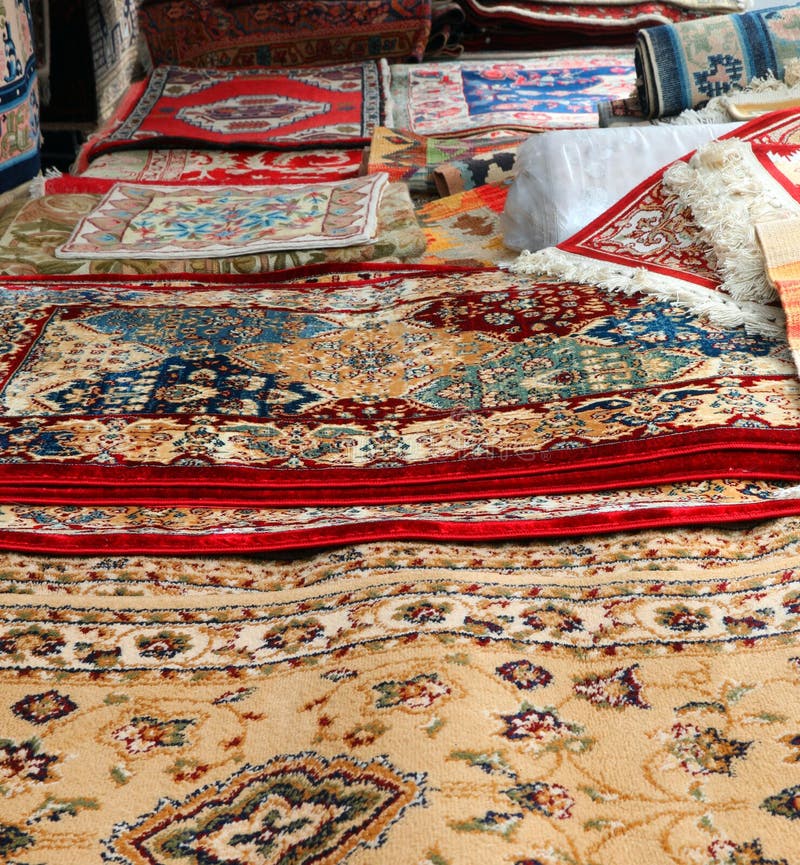 Carpets and Rugs Rolled Up & Displayed Stock Image - Image of woven ...