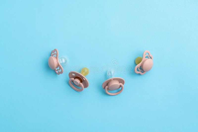 Pacifiers on Blue Background with Copy Space, Top View of Soothers ...