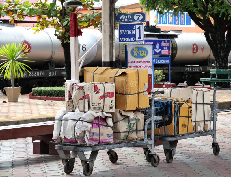 Many Parcels Waiting To Be Sent in the Cart. Train Platform Area ...