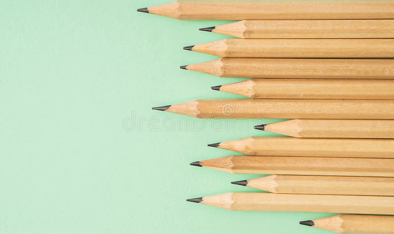 Many Pencils on Green Table Stock Image - Image of school, yellow: 75887557