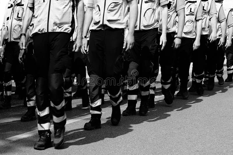 Many People Marching in the Streets with Uniforms Stock Photo - Image ...